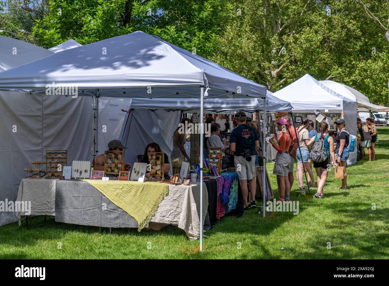 An artist works on a painting at the annual Moab Arts Festival in Moab ...