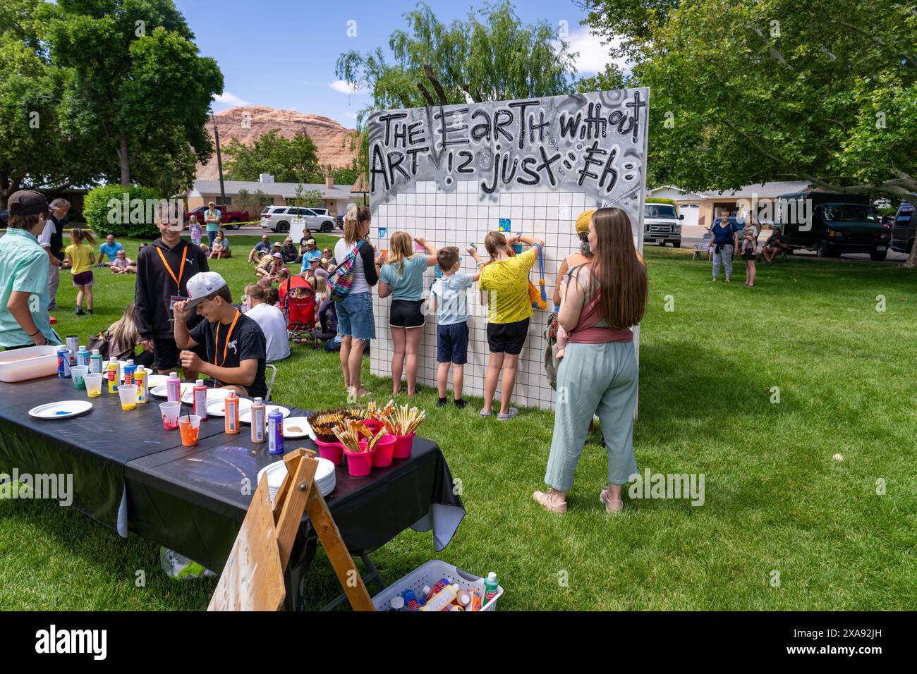 Kids painting on a mural at the annual Moab Arts Festival in Moab, Utah ...