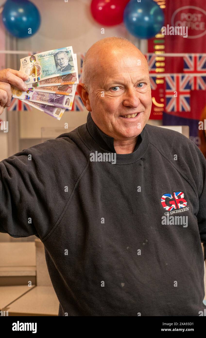 EDITORIAL USE ONLY Banknote collector, Colin Smoothy with the new-look ...