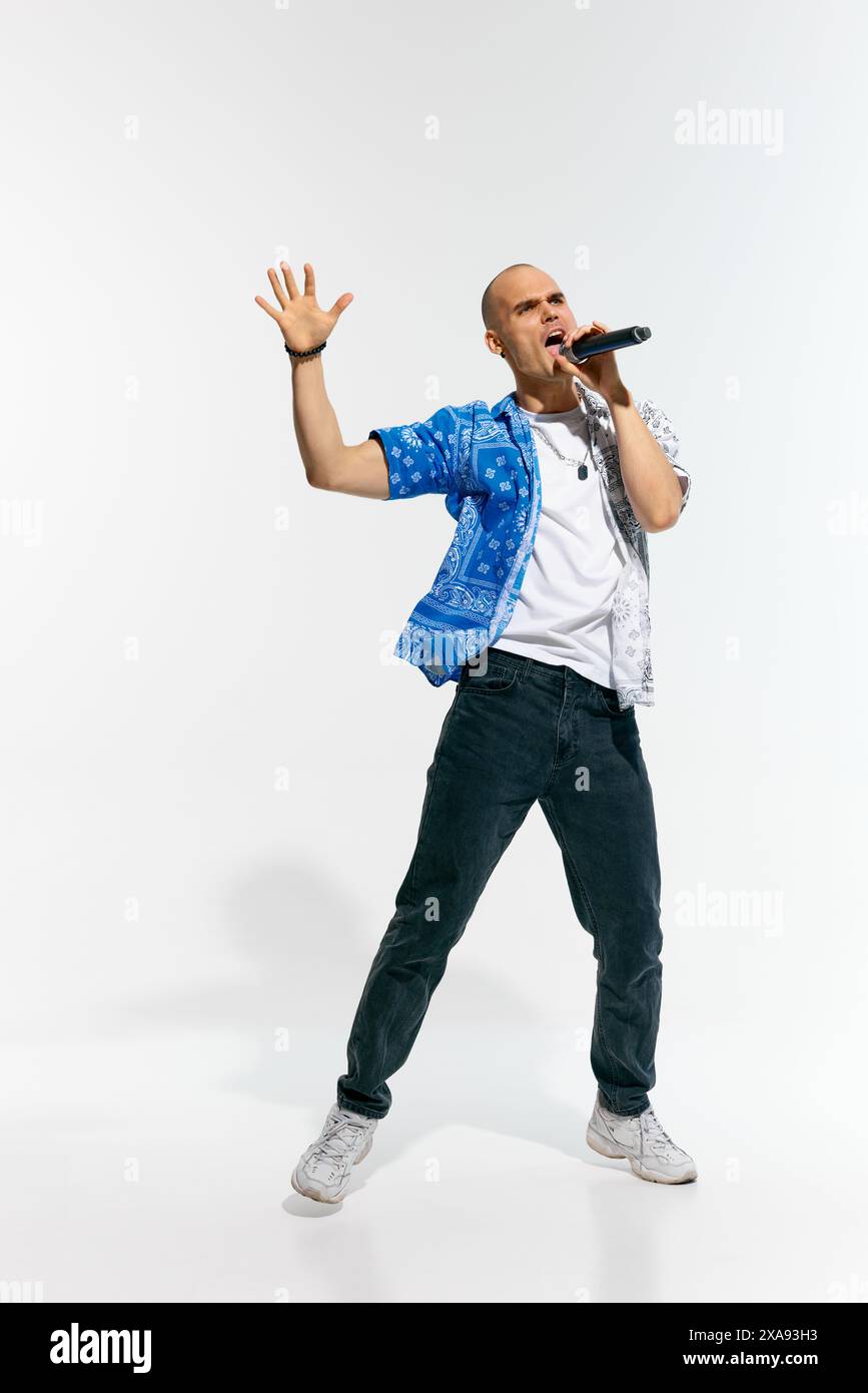 Artistic young guy dressed fashion outfit, vocalist, rapper ...