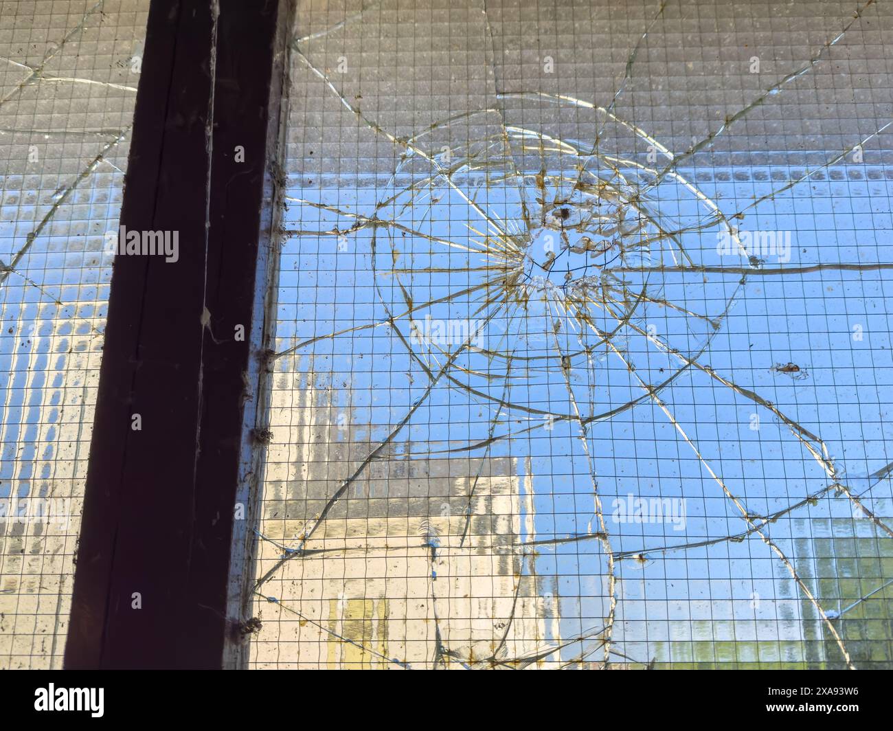 Broken glass pane after a break-in Stock Photo - Alamy