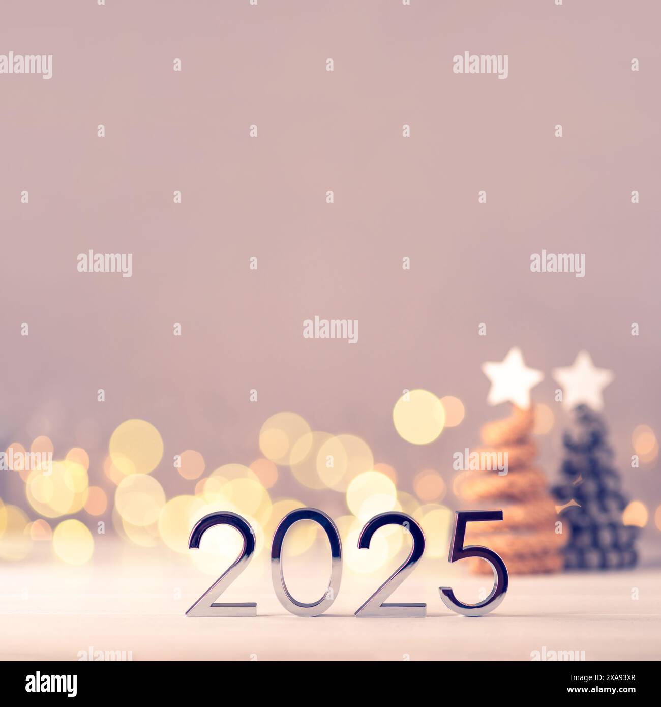 Metal numbers 2025 on table with bokeh lights Stock Photo - Alamy