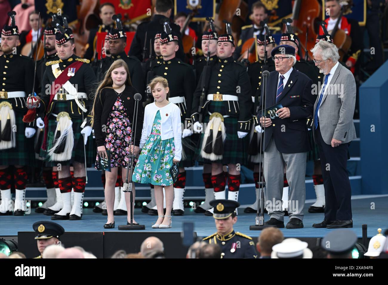 D-Day veteran Eric Bateman speaks alongside his son-in-law Keith and ...