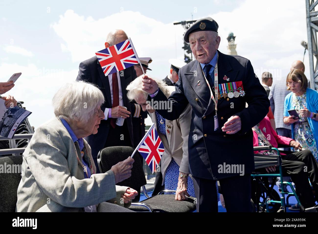 D-Day veteran Joe Randall, 100, dances in the stands as he waits to ...