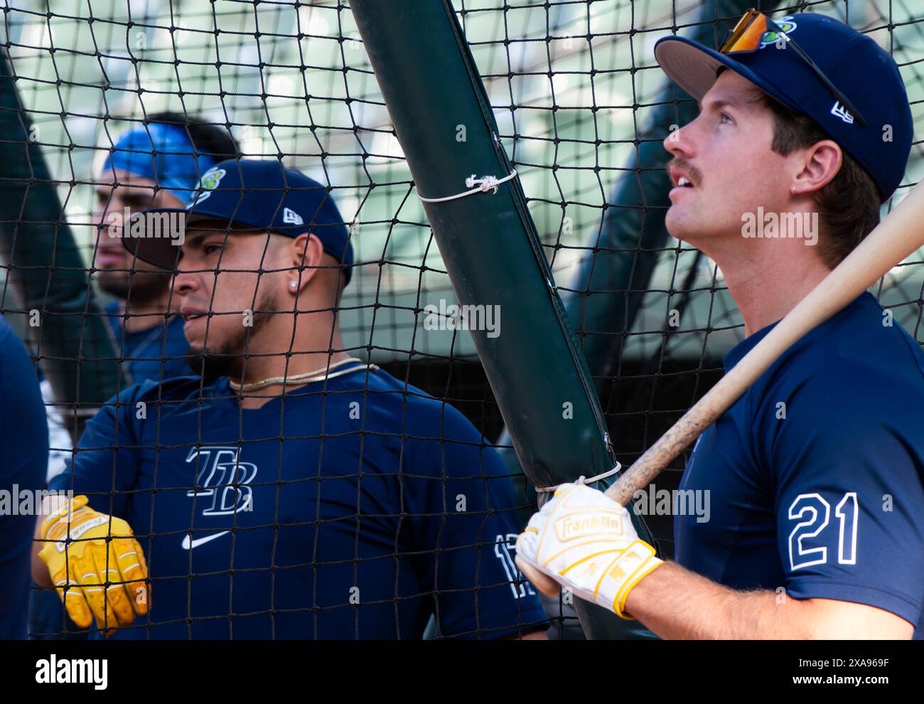 Three players at batting practice in a baseball stadium Stock Photo - Alamy