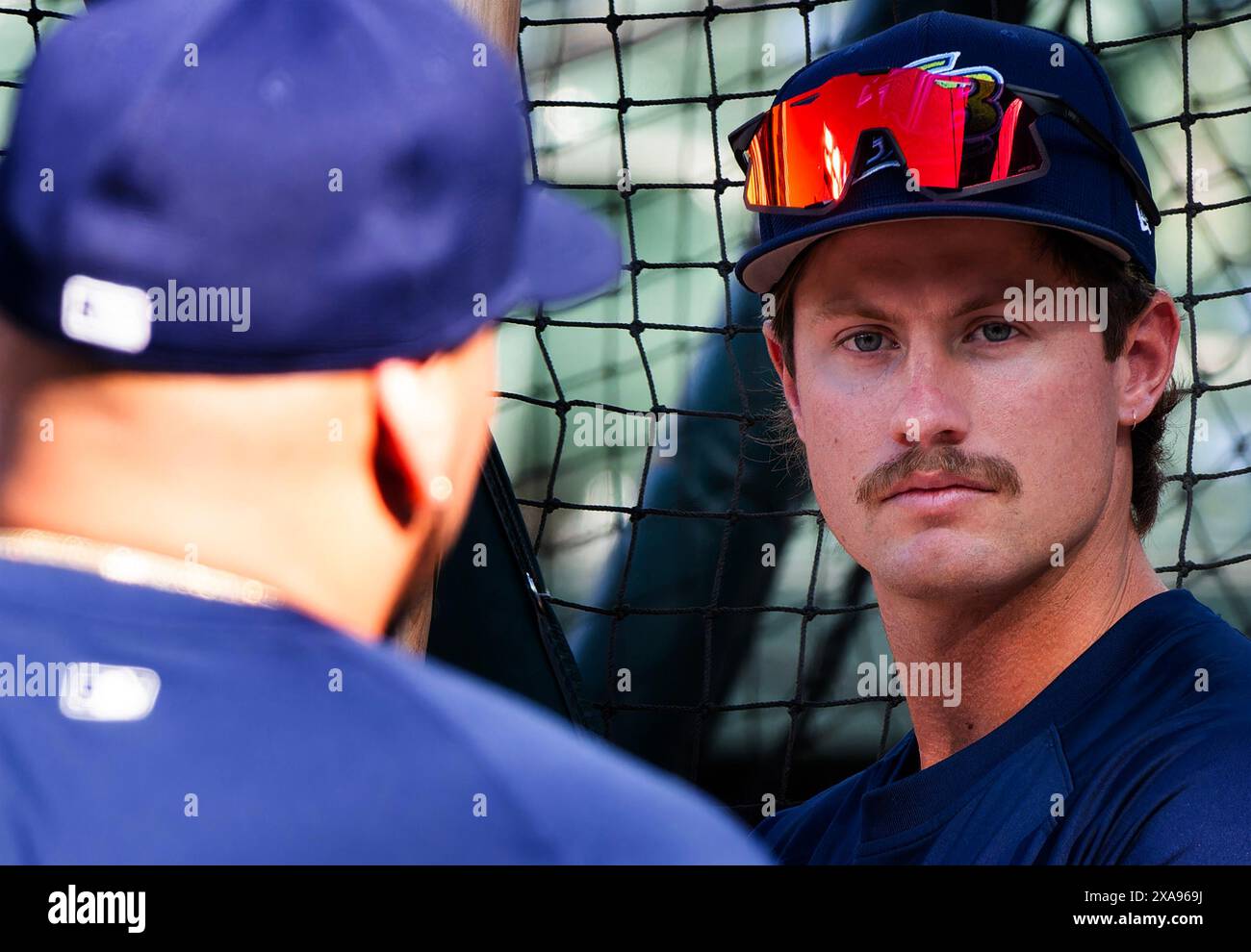 Three players at batting practice in a baseball stadium Stock Photo - Alamy