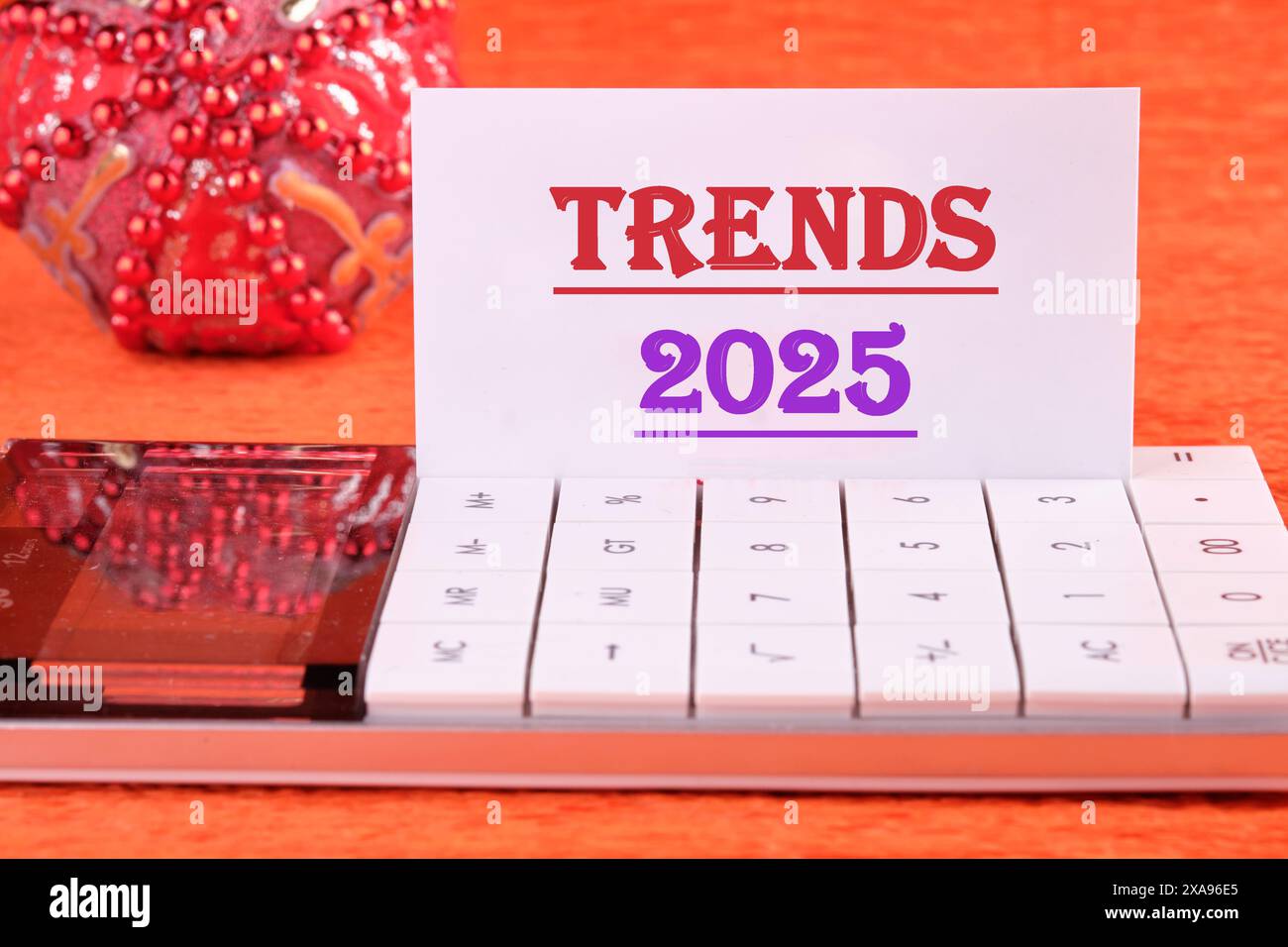 2025 trend concept. TRENDS 2025 on a white business card with a ...