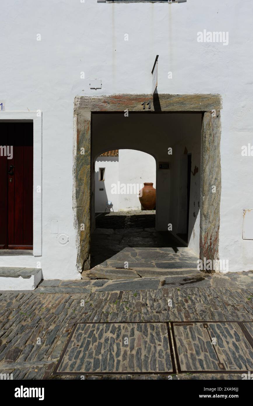 View of a narrow way in a village Stock Photo - Alamy