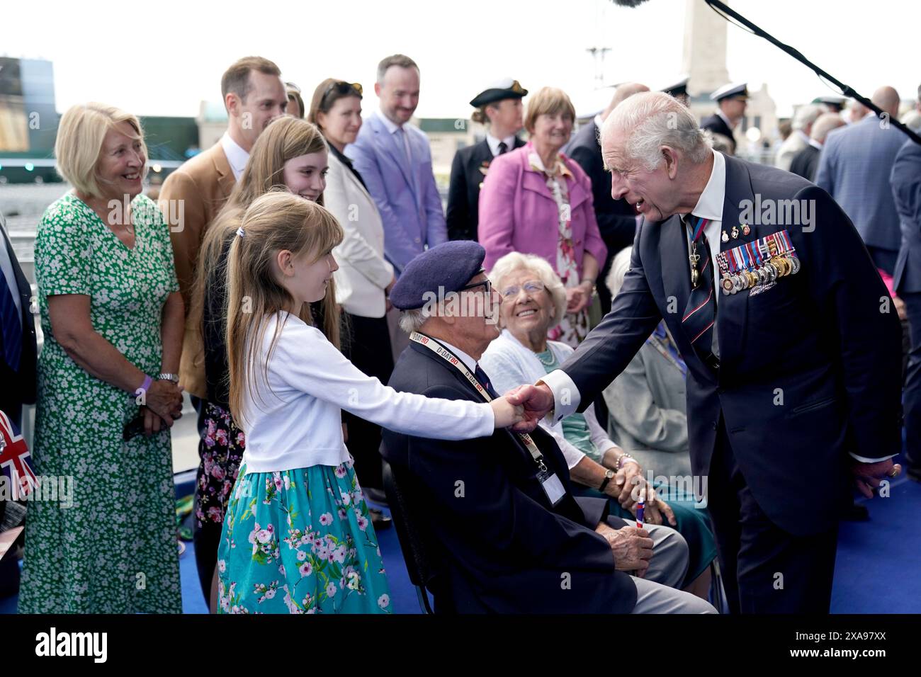 King Charles III meets D-Day veteran Eric Bateman and his family ...