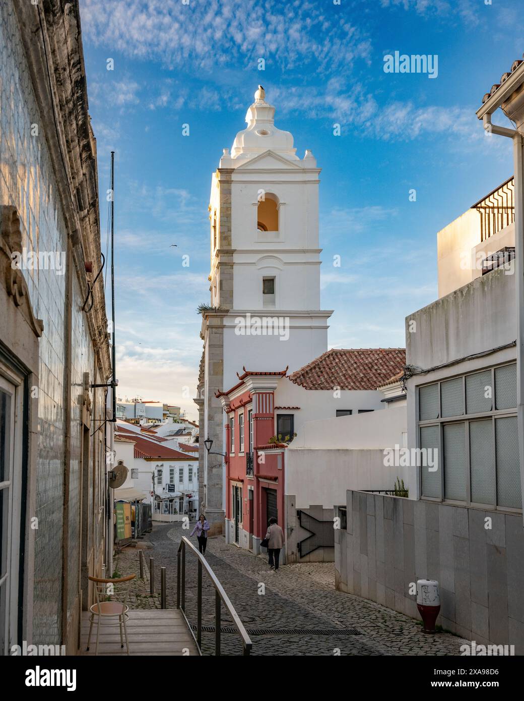 Narrow cobblestone street in Lagos which is a town in southern Portugal ...