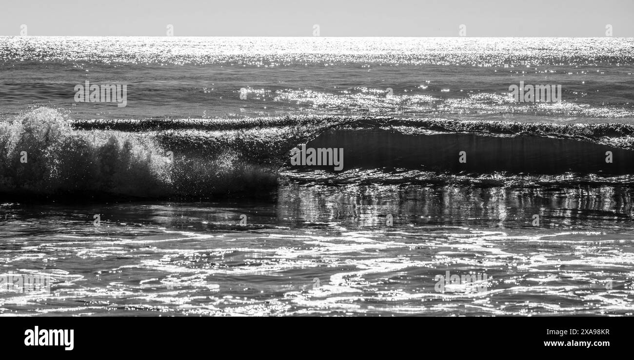 Ocean waves breaking along the shoreline of Sagres that sits at the ...