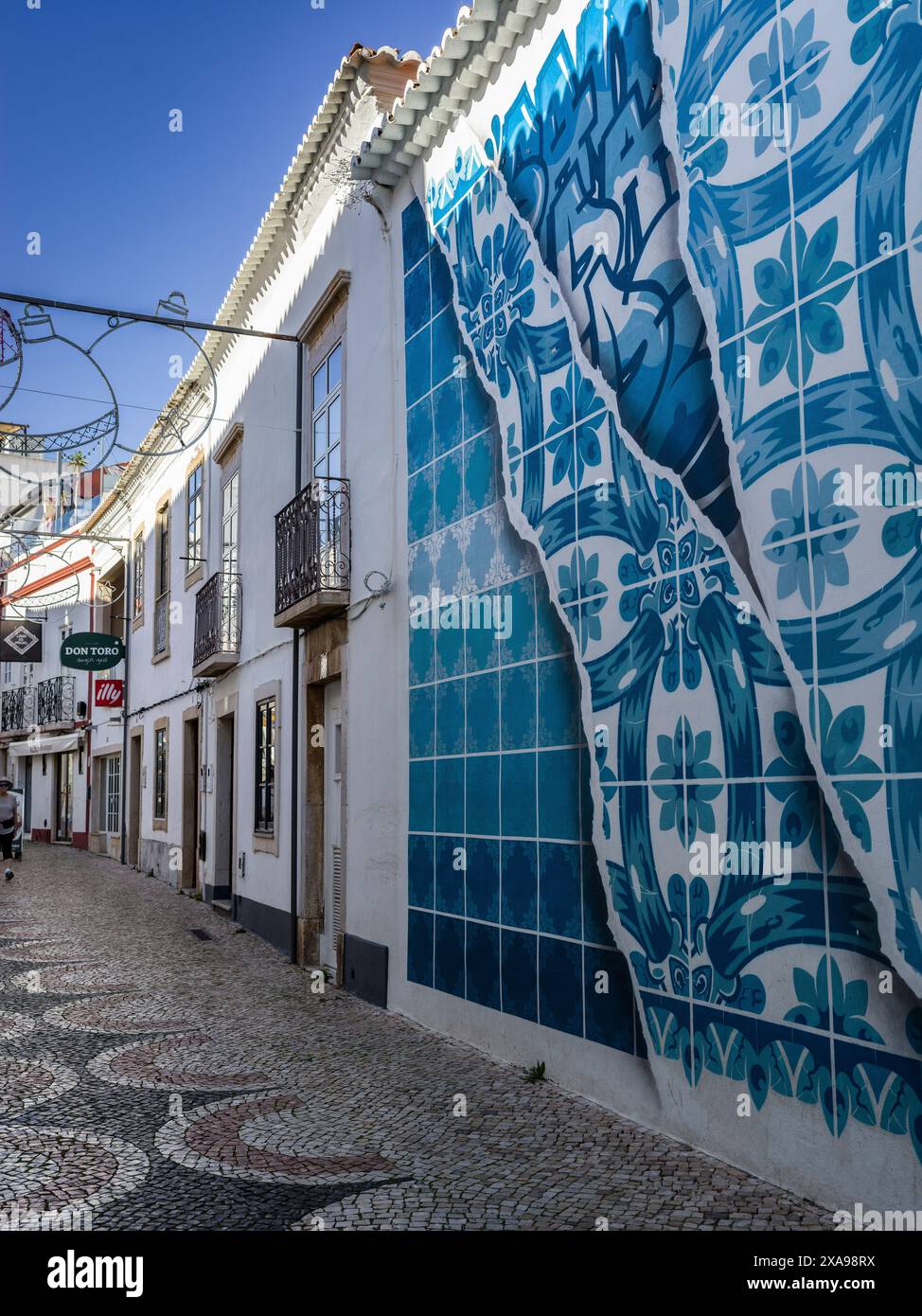 Pattern in blue symbols painted on the exterior of a building in Lagos ...