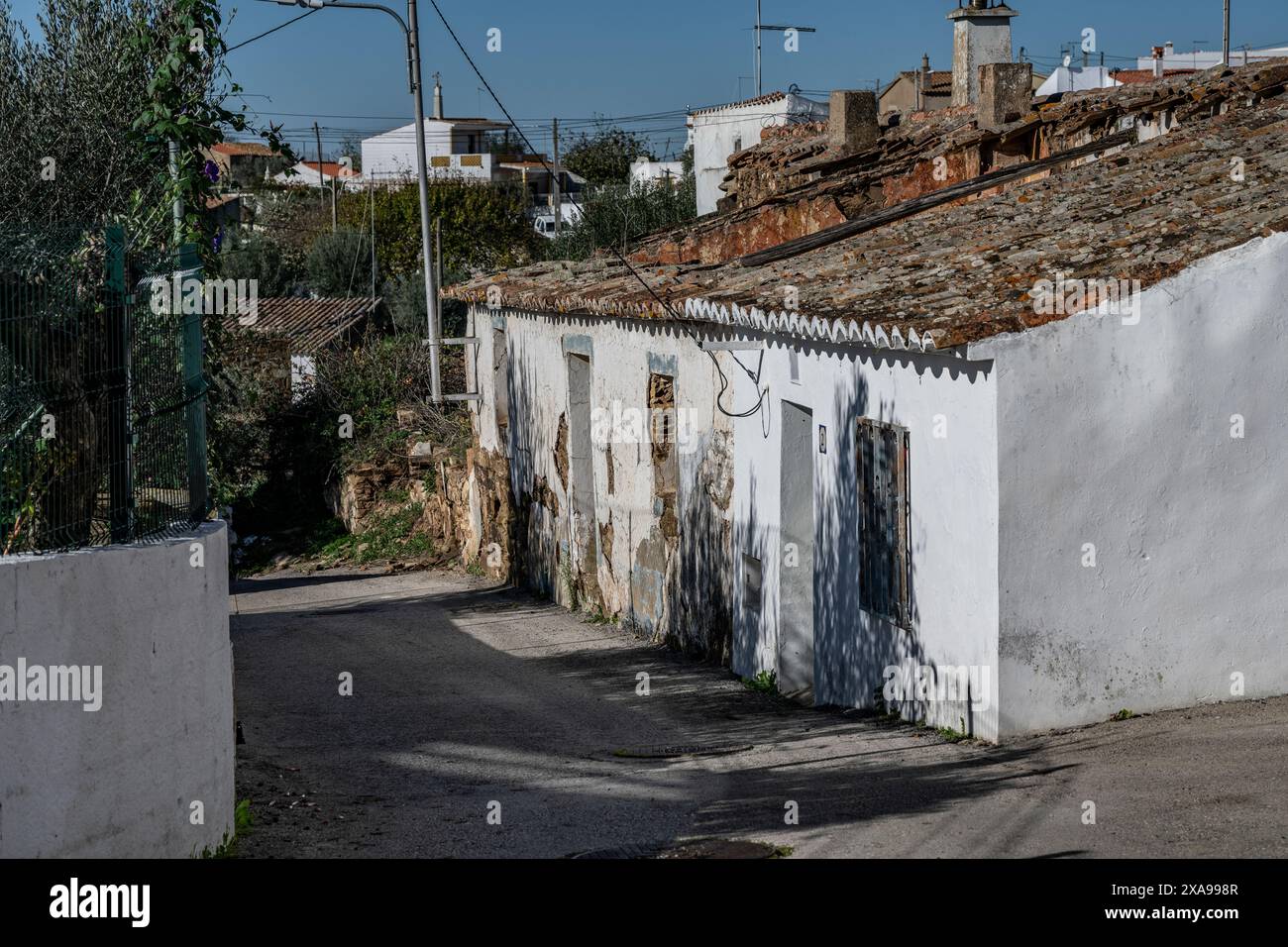 Derelict building along a street in the city of Ameixial, Faro ...