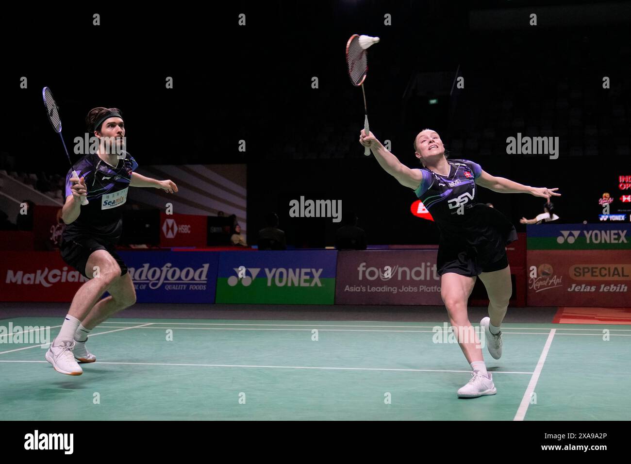 Denmark's Mathias Christiansen, left, and Alexandra Boje play against ...