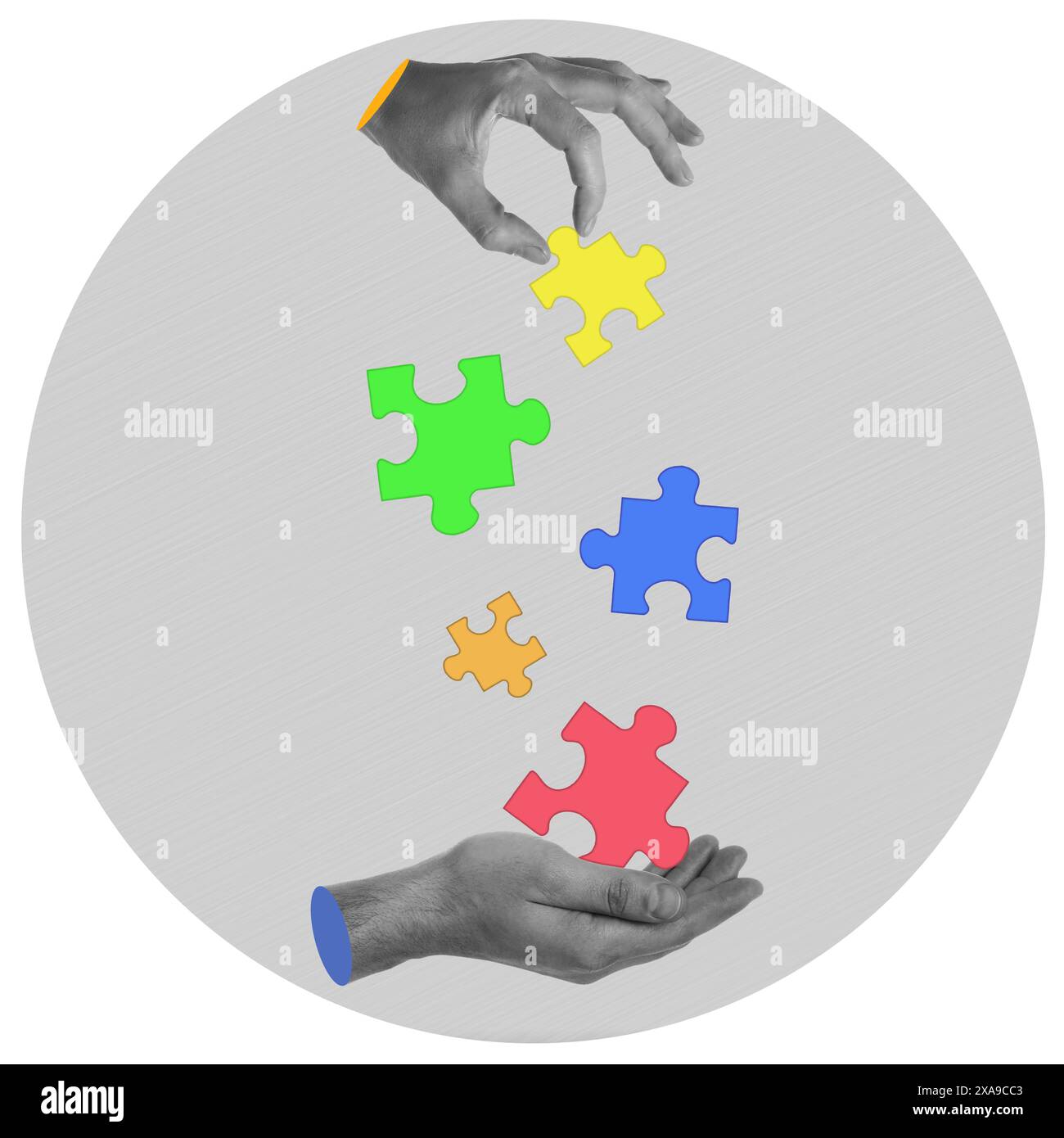 Hand dropping jigsaw puzzle pieces and other one catching them ...