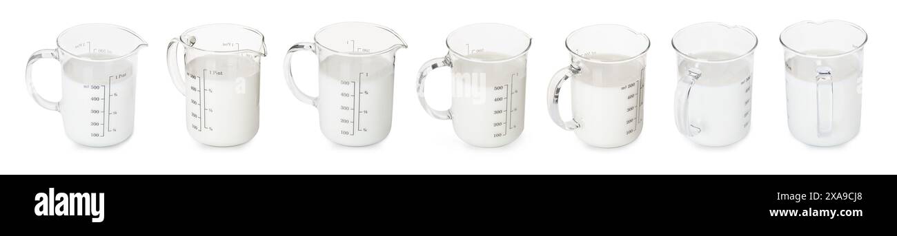 Fresh milk in measuring cup isolated on white, set Stock Photo - Alamy