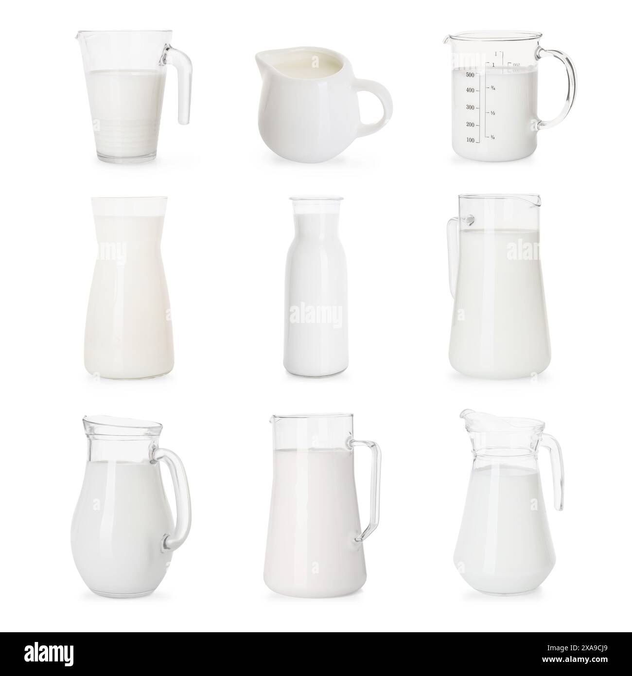 Fresh milk in jugs isolated on white, set Stock Photo - Alamy