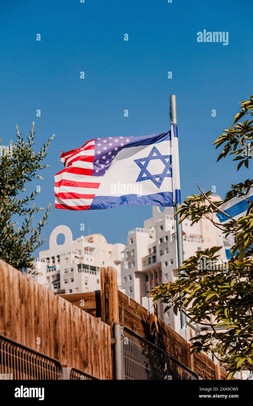 Israeli American friendship flag is flattering in the wind. Hybrid flag ...