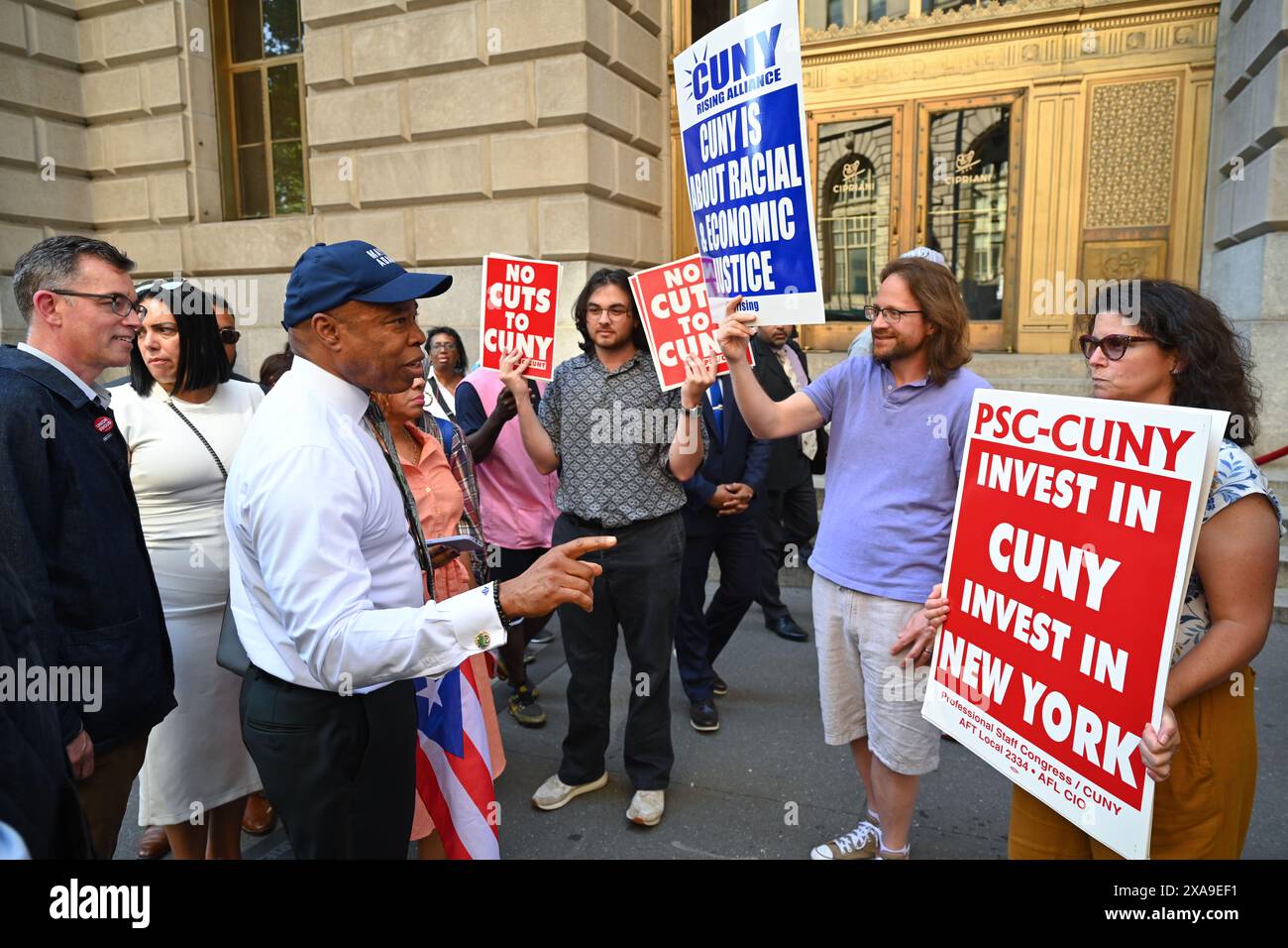 Mayor Eric Adams talks with protestors after he delivers remarks at ...
