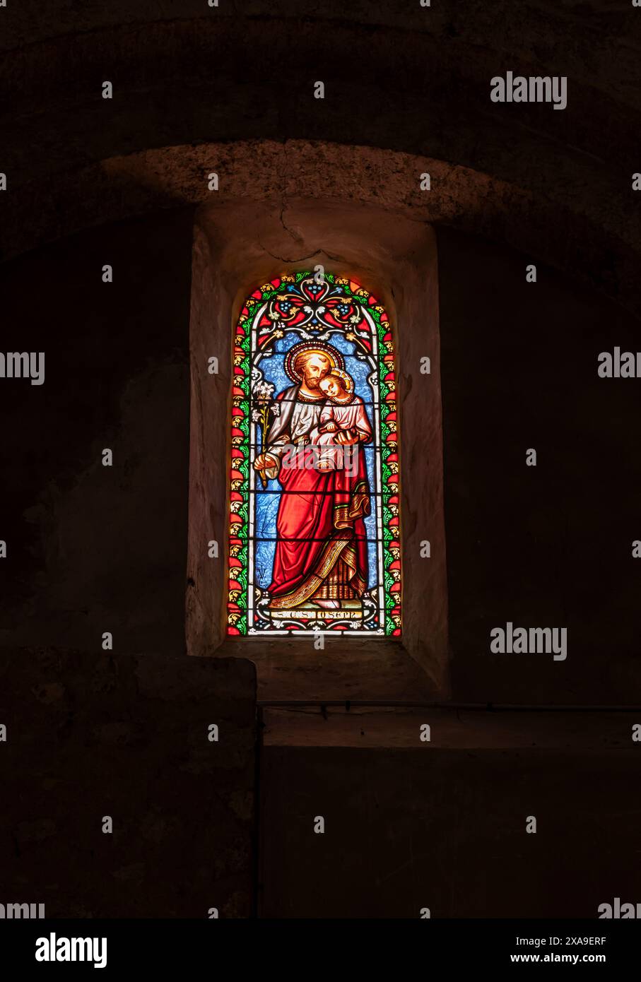Colourful stained glass window depicting Joseph and Jesus, Notre-Dame ...