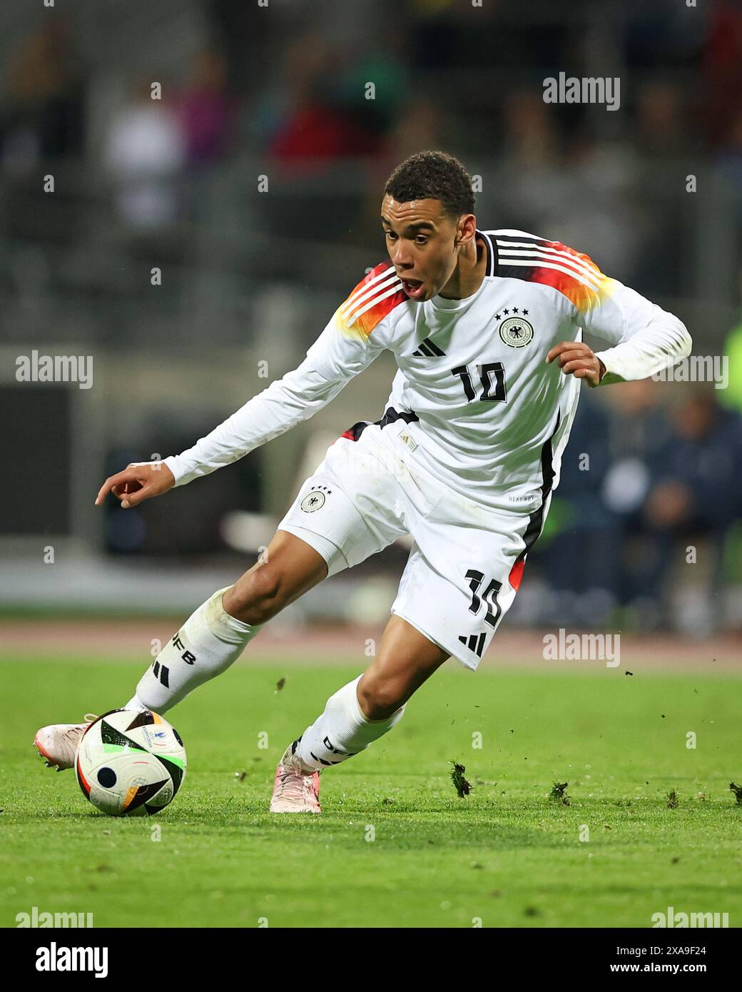 NUREMBERG, GERMANY - JUNE 03: Jamal Musiala of Germany runs with a ball ...