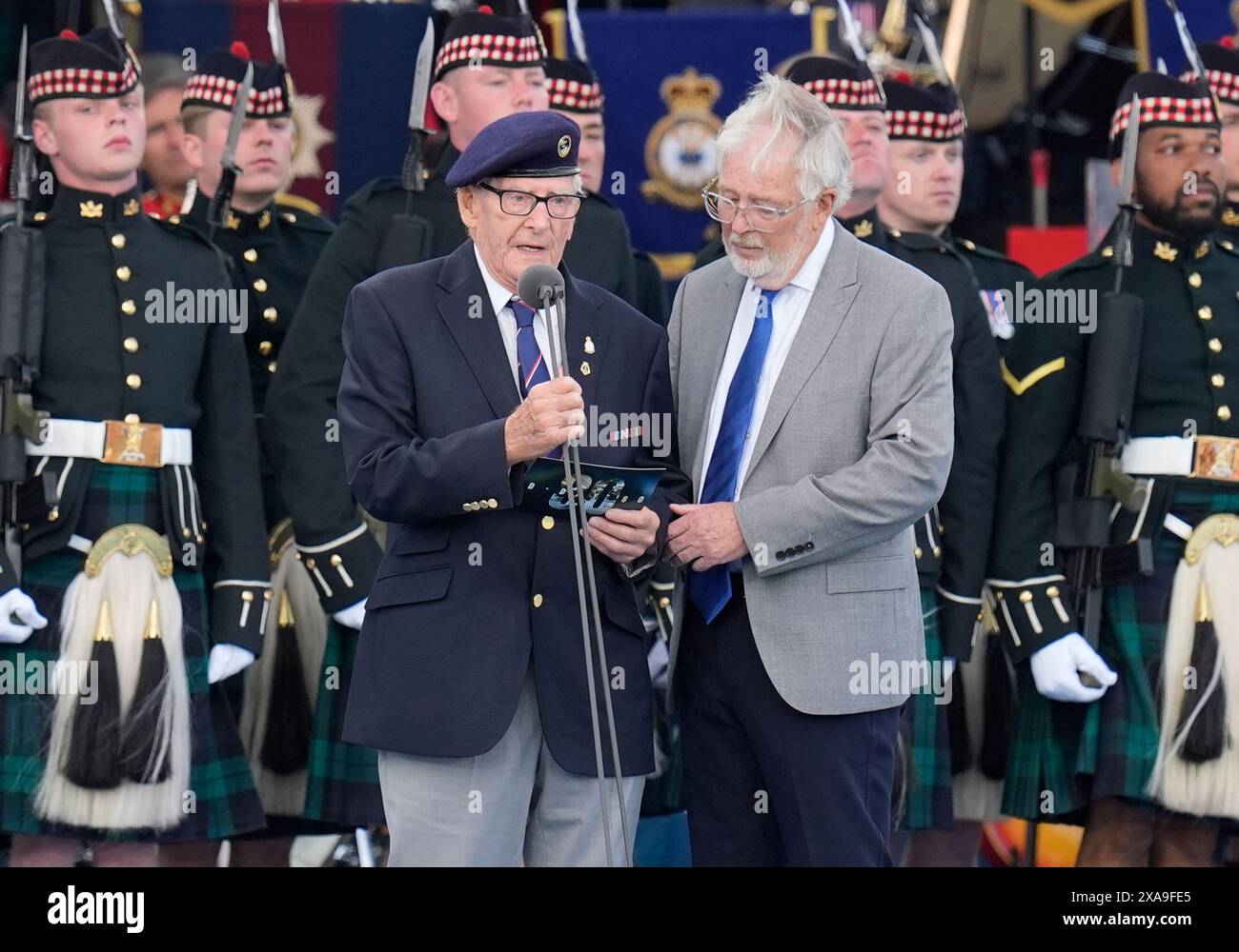 D-Day veteran Eric Bateman speaks alongside his son-in-law Keith (right ...