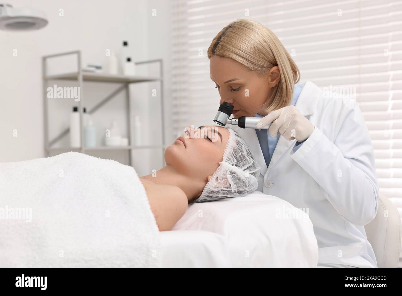 Dermatologist dermatoscope examining patient`s hi-res stock photography ...