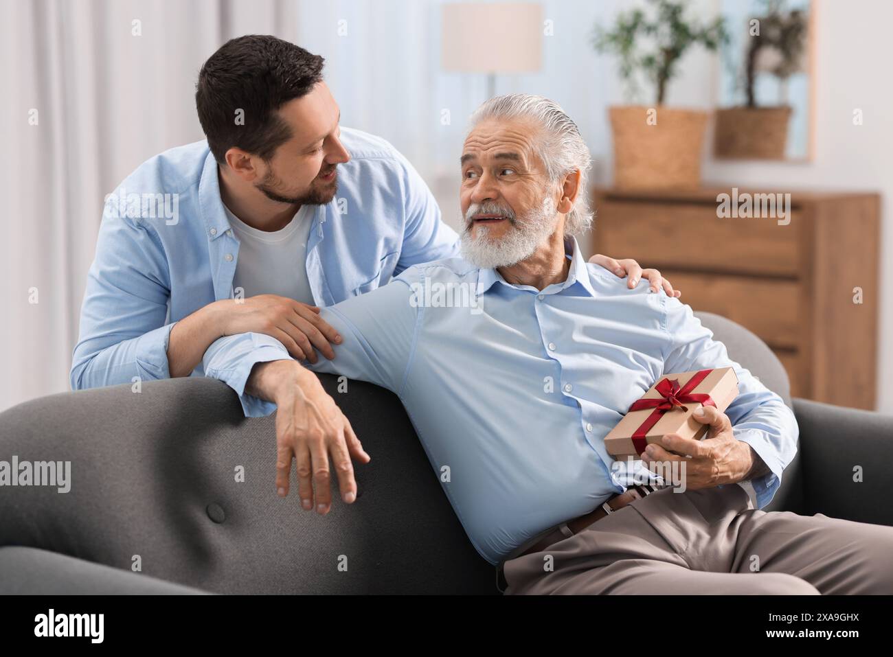 Portrait happy grandfather giving hi-res stock photography and images - Alamy