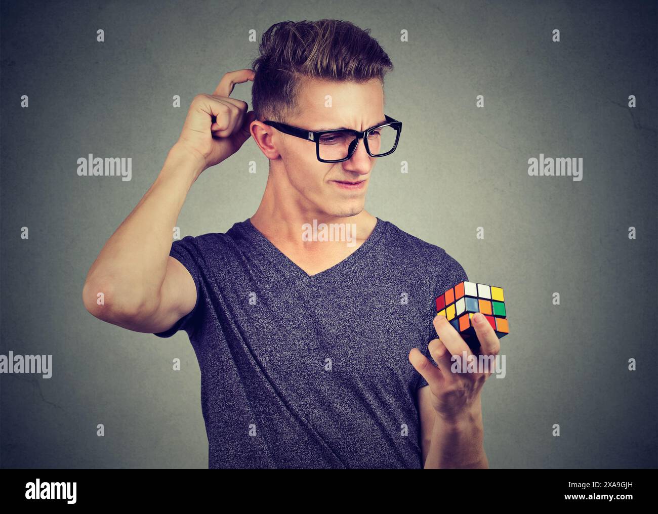 Man holding rubiks cube hi-res stock photography and images - Alamy
