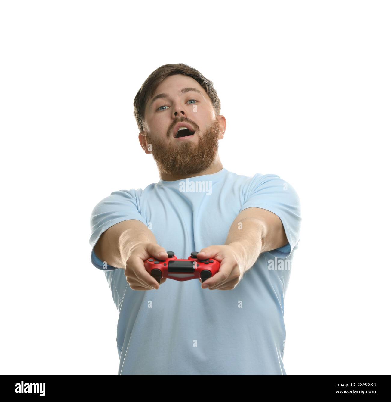 Surprised man playing video game with controller on white background ...