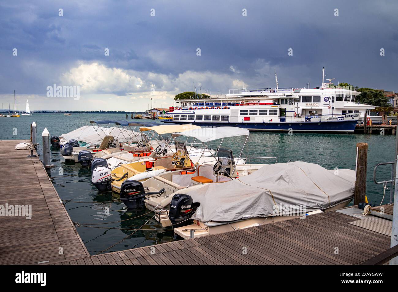 Desenzano, Lake Garda, Italy - 25 May 2024 Colorful motorboats and tour ...