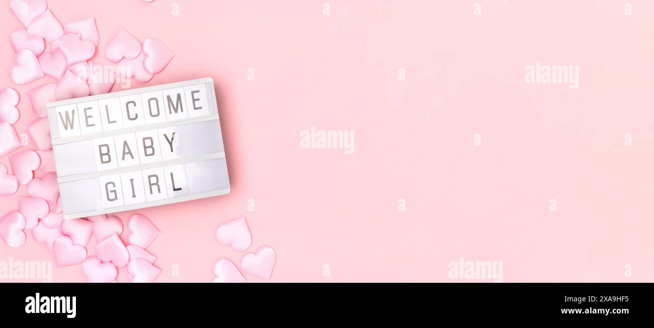 Welcome baby girl. Banner with lightbox and confetti in a heart shape ...