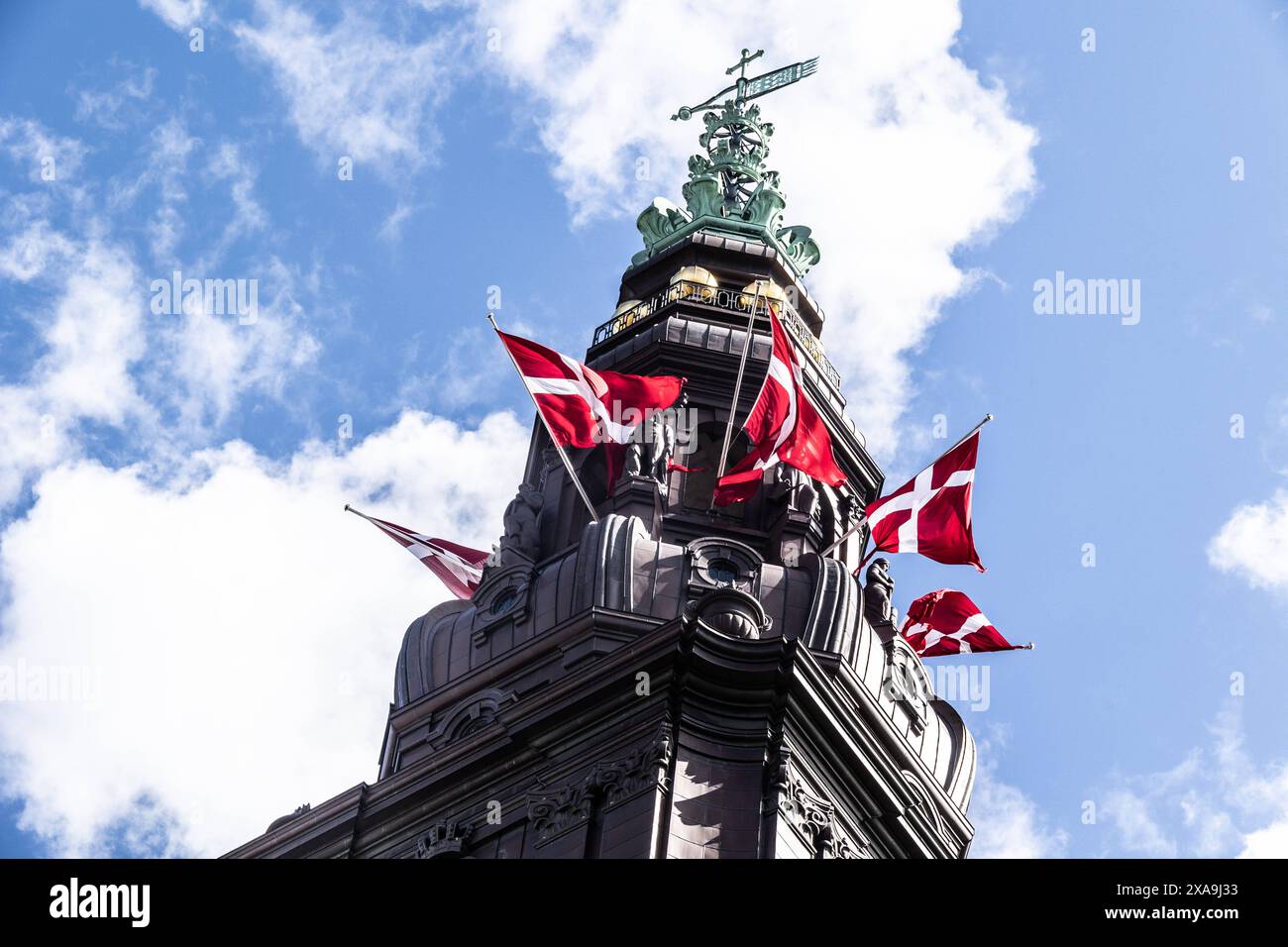 The Danish flag flutters in the spire of Christiansborg Castle, the ...