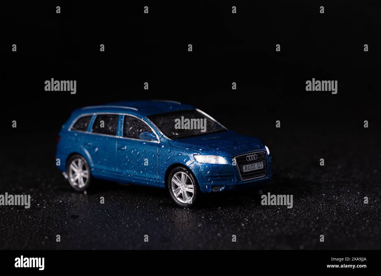 May 20, 2020 Kyiv, Ukraine. Miniature model of a blue SUV car on a ...