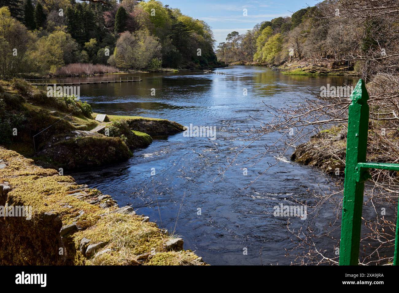 Forced through the narrow bridge, with turbulent water, a view of the ...