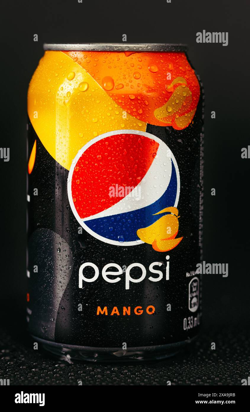 Kyiv, Ukraine - February 26, 2020. Pepsi mango on a black background ...
