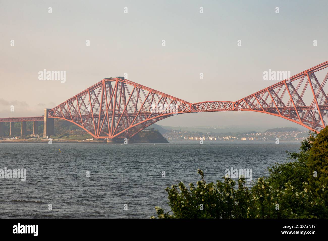 A train traverses the iconic Forth Bridge. Completed in 1890, the ...