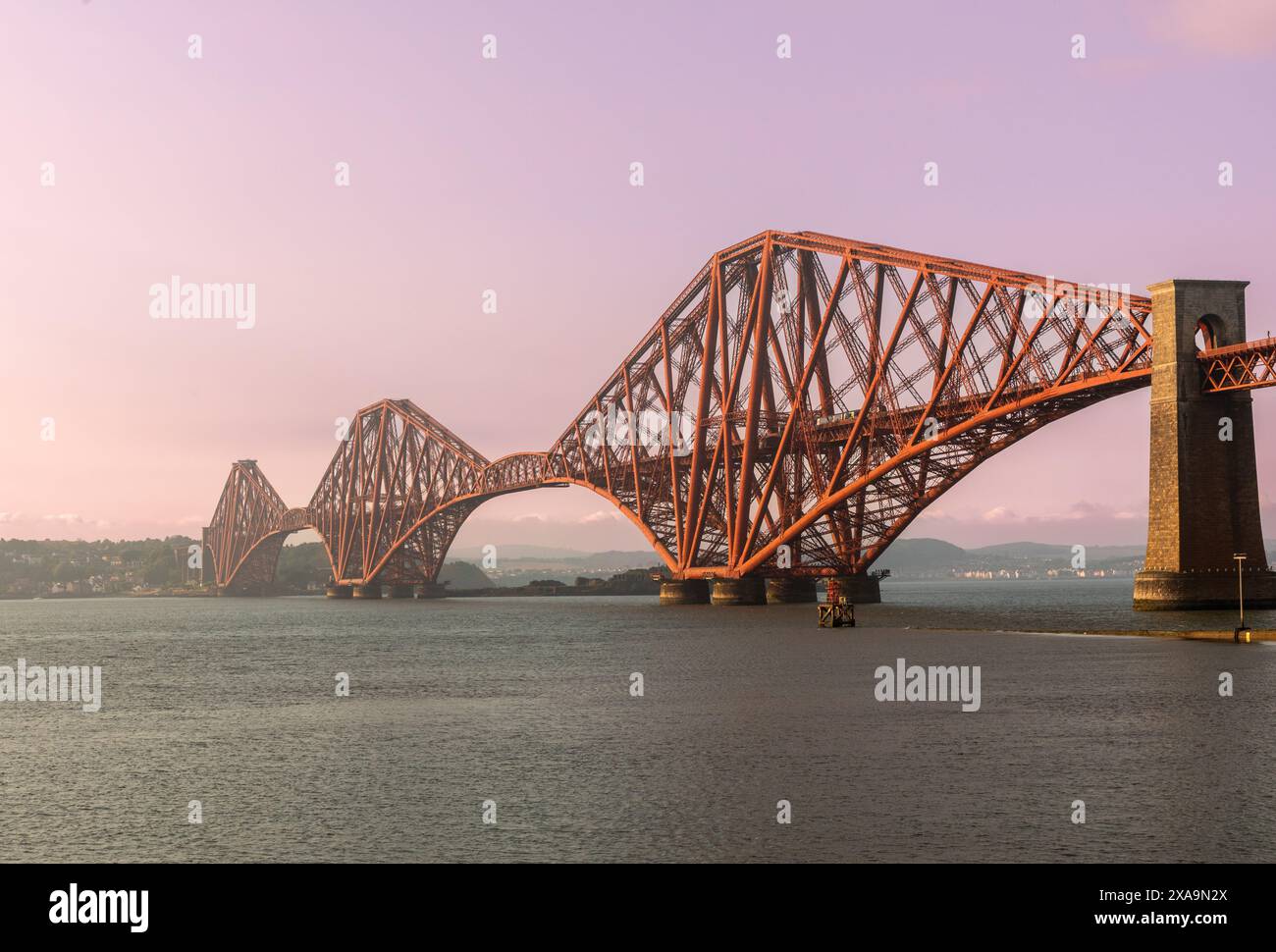 The iconic Forth Bridge, a cantilever railway bridge, spans the Firth ...
