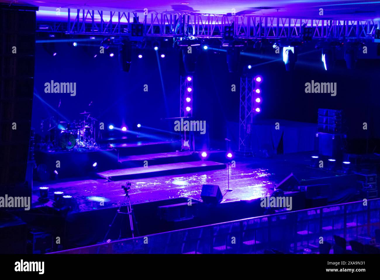 concert lights, illuminated stage in interior space, artificial ...