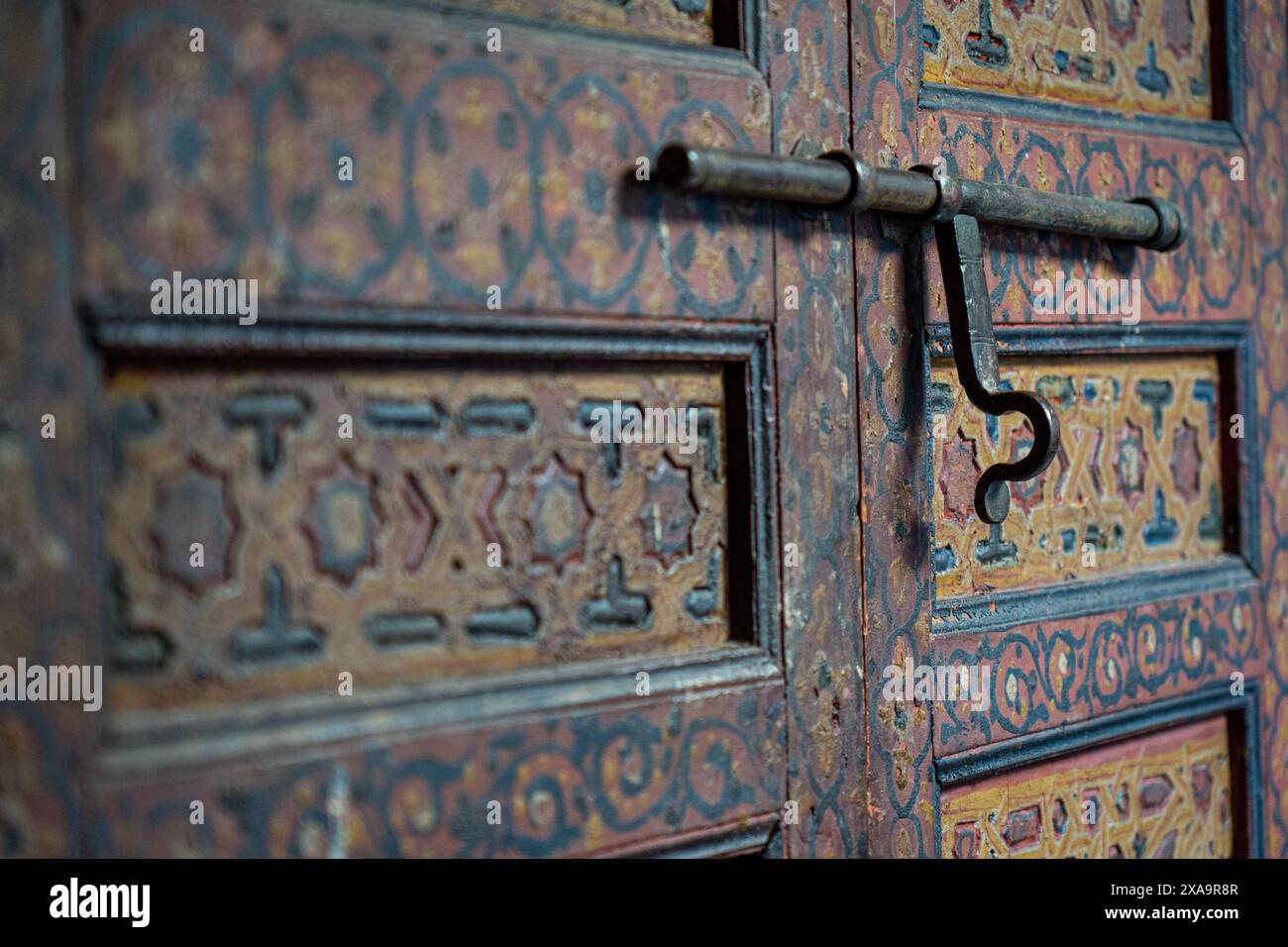An ornate painted door secured with a key in Fez, Morocco Stock Photo ...