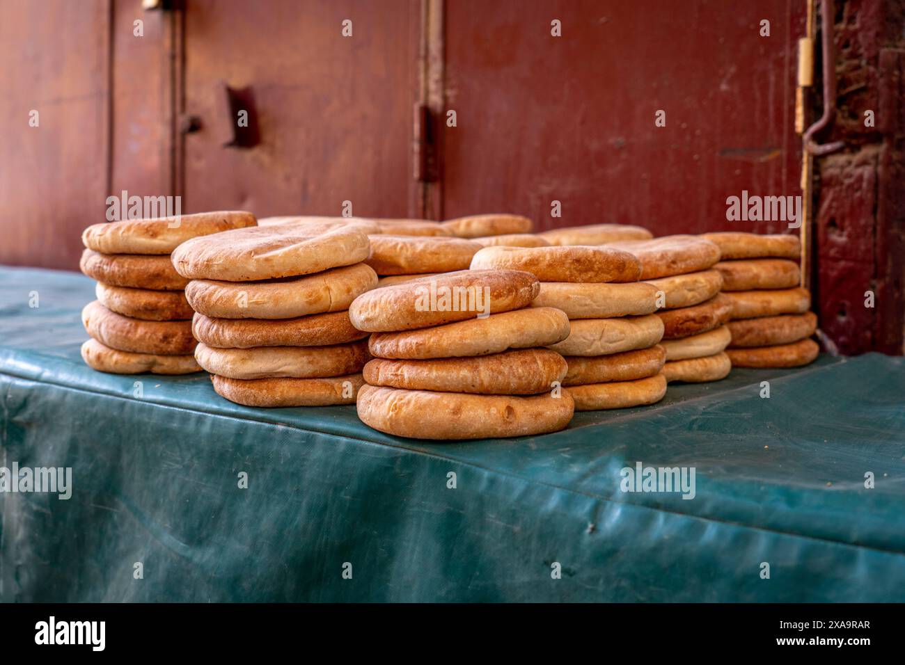 The assorted bread loaves arranged neatly on a table Stock Photo - Alamy