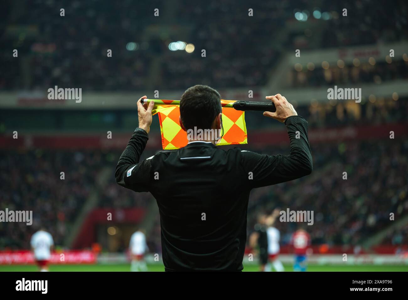 Assistant of soccer referee shows players substitution during football ...