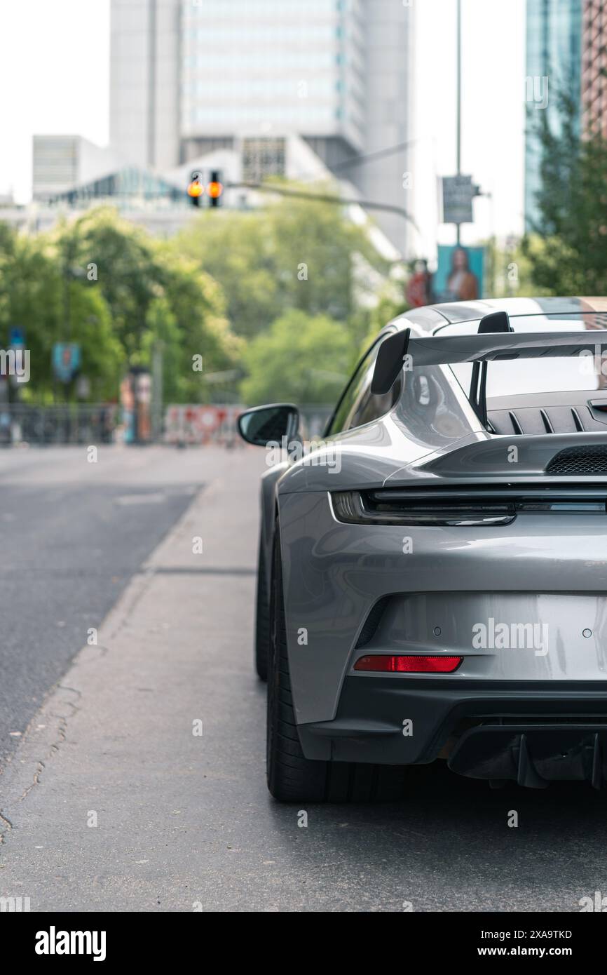 A rear view of Porsche 911 GT3 in the 992 generation standing on the ...