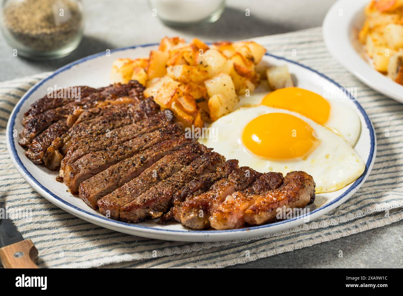 Healthy Breakfast Steak and Eggs with Hash Browns Stock Photo - Alamy