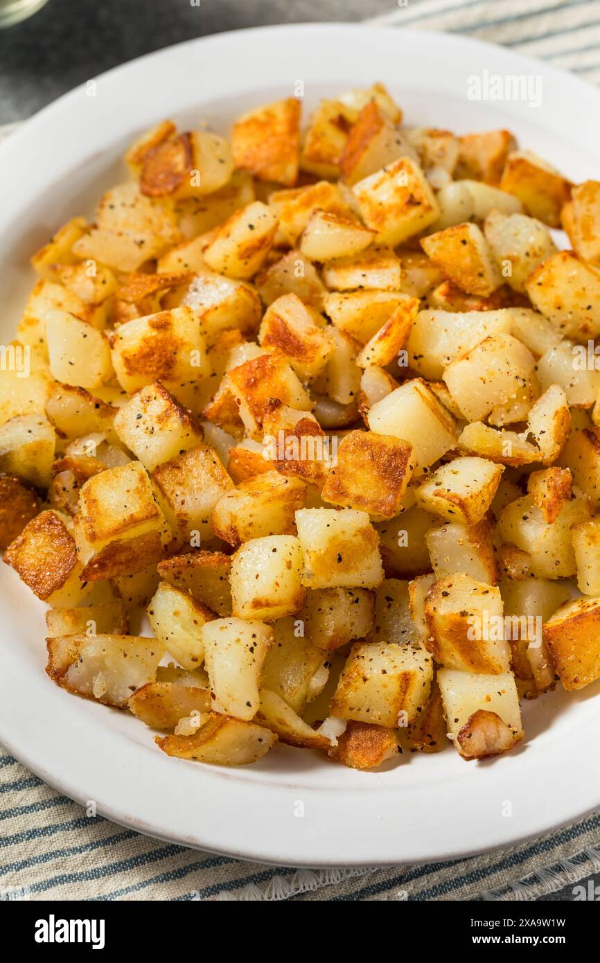 Homemade Fried Potato Hash Browns with Salt and Pepper Stock Photo - Alamy