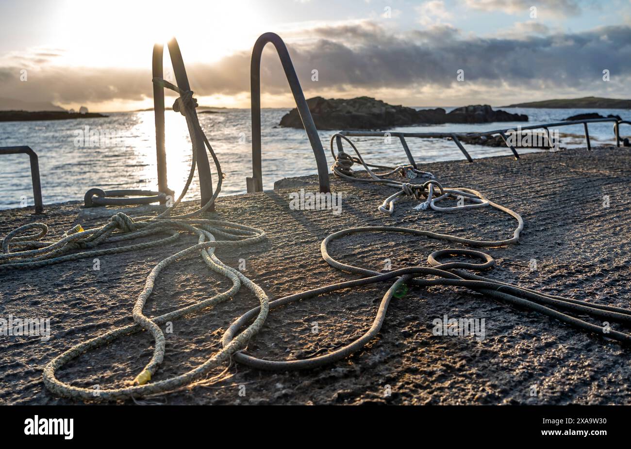 Emergency ladder and ropes at coastal harbour Stock Photo - Alamy