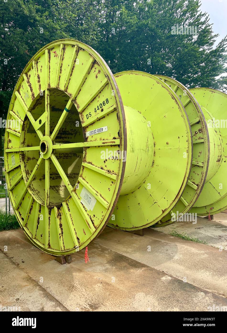 Two green metal wire reels next to each other Stock Photo - Alamy