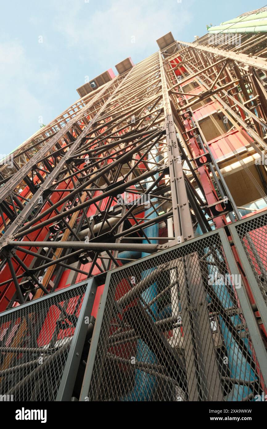 Colorful buildings serve as a vibrant backdrop to a tall metal ...