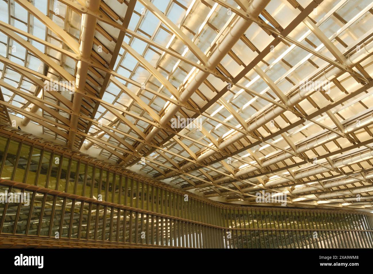 A close-up of a building's roof and glassy wall structure Stock Photo ...