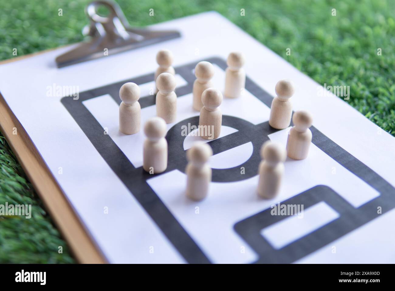 Football tactical clipboard on top of green football field. Football ...